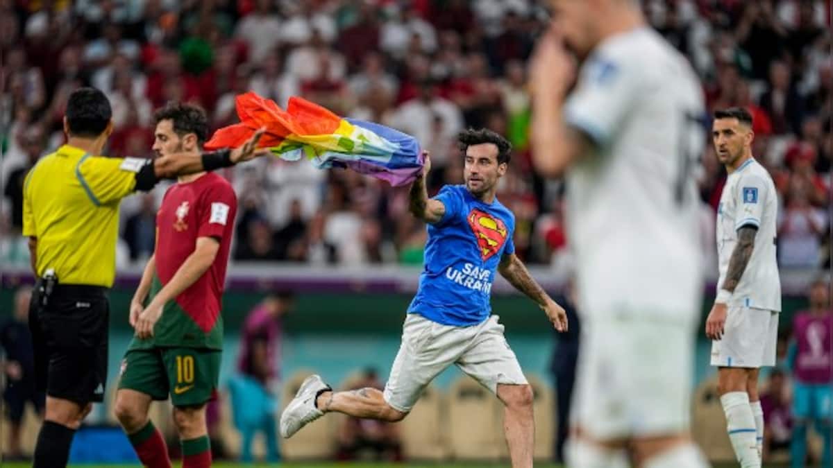 FIFA World Cup: Pitch invader with rainbow flag released after a brief ...
