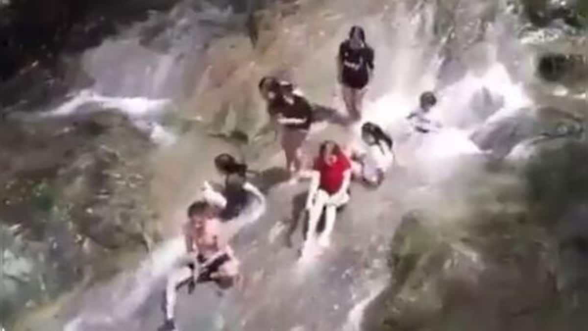 Viral video shows 'unaware' people being washed away by flash flood ...