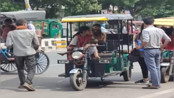 Viral video shows mother steering e-rickshaw with baby in arms ...