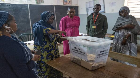Senegalese await the outcome of a peaceful presidential vote, following ...