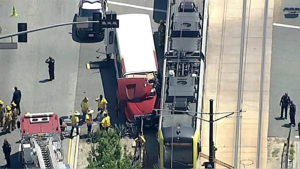 More than 50 people injured as metro train crashes with bus in downtown ...