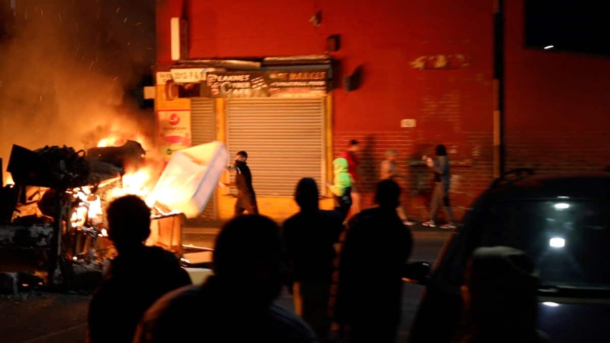 Police cars flipped, bus on fire: What's behind the riots in UK's Leeds ...