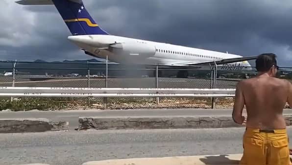 What happens if you stand behind a plane during takeoff? Watch the ...