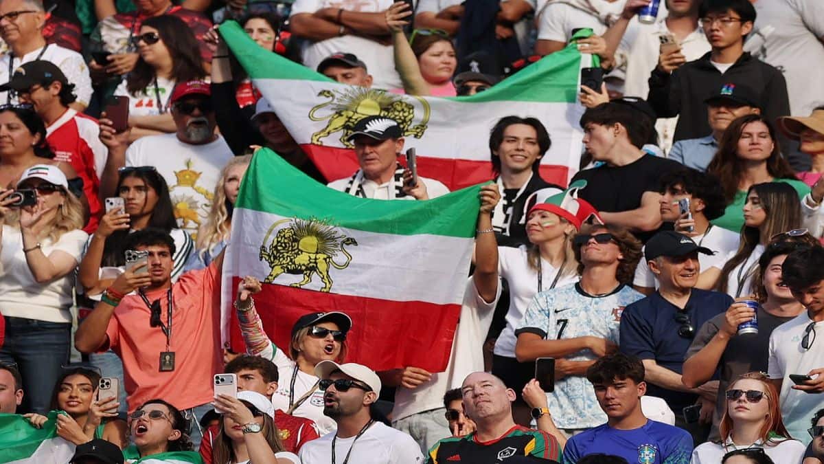 Fans defy FIFA ban on Iran’s pre-revolution flag. What’s the ...