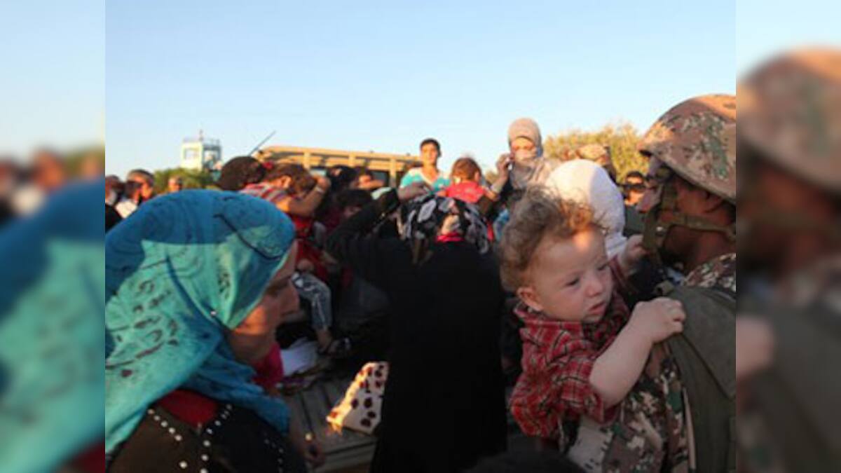 Syrian troops seize refugee flight route – Firstpost