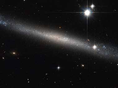 NASA's Hubble captures image of one of the flattest galaxies – Firstpost