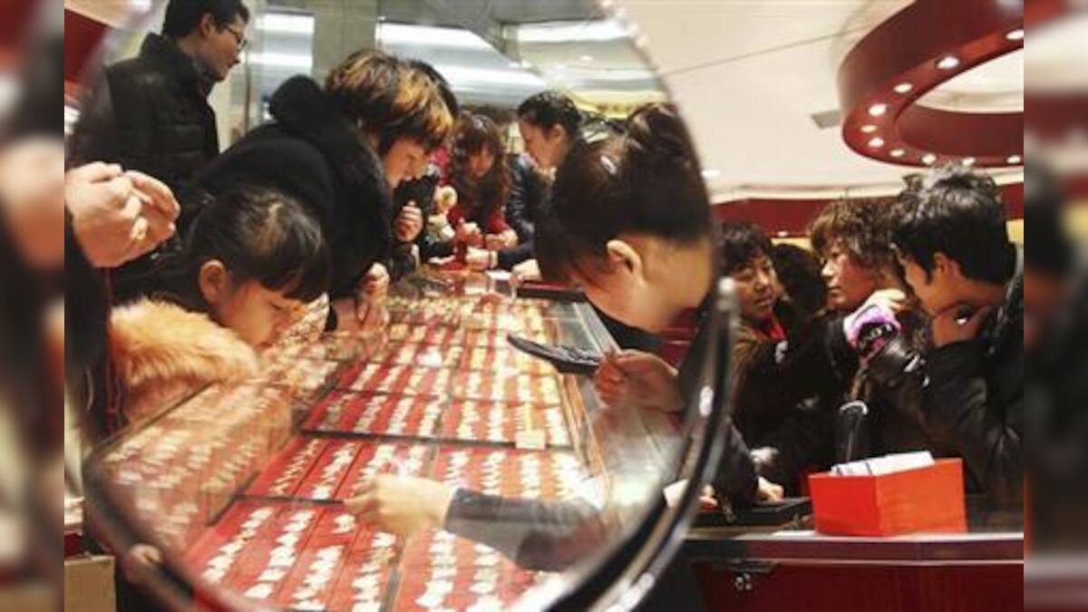 Gold erases gains after Bernanke comments – Firstpost