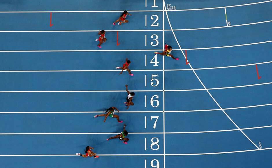 Images: A streak of pink! Fraser-Pryce steals the show from Usain Bolt ...