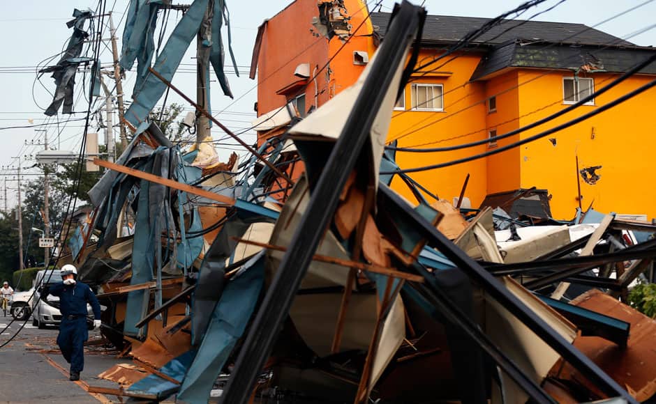 Photos: Upturned cars, destroyed houses as tornado rips through Japan ...