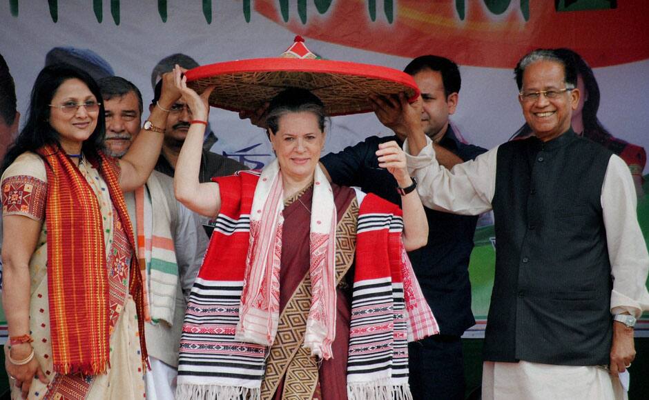 Sonia vs. Modi: who pulls off Assamese headgear better? - Photos News ...