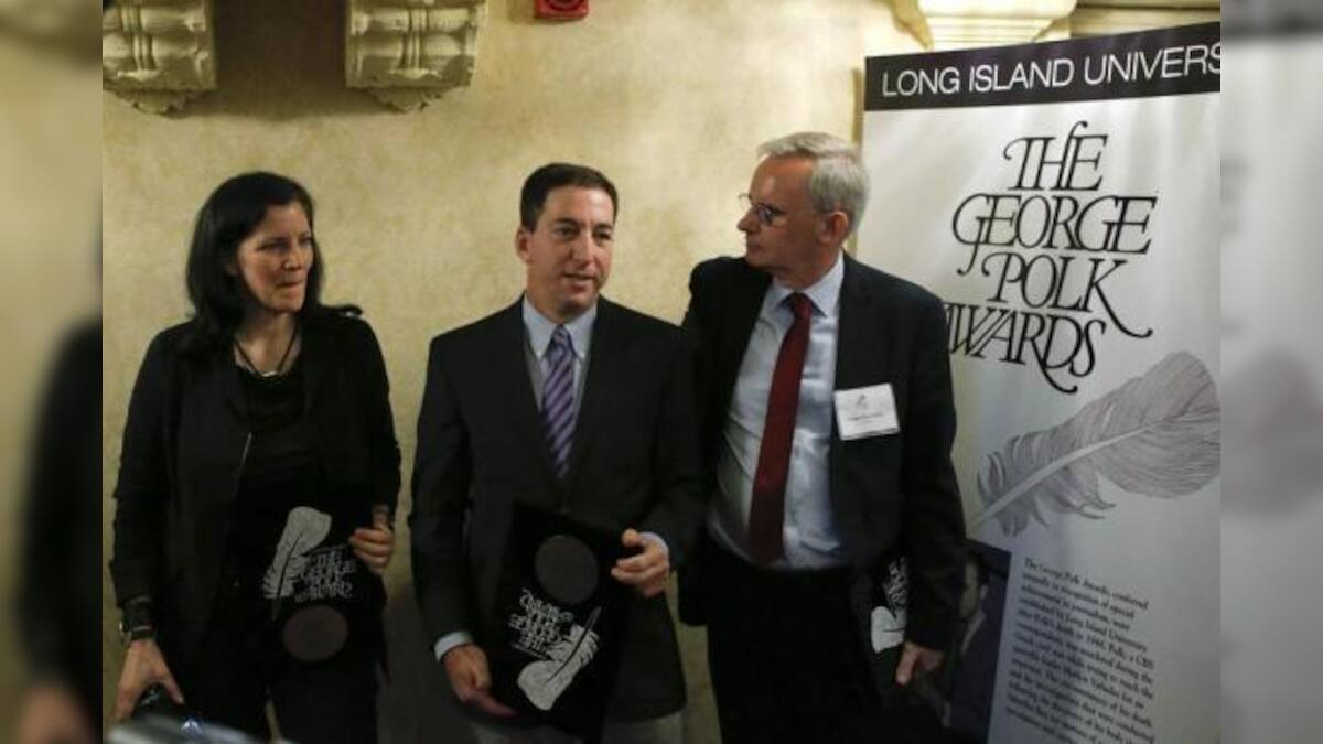 Reporters who broke Snowden story return to U.S. for first time – Firstpost