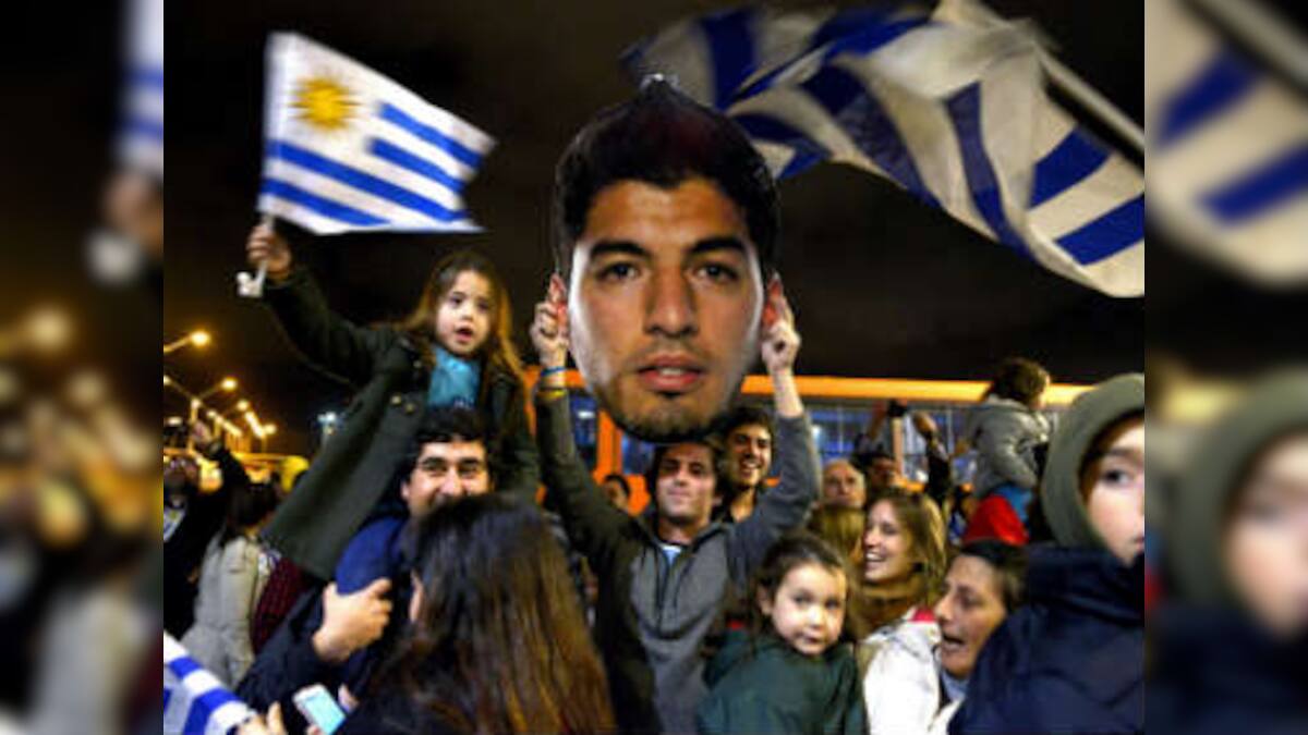 FIFA 2014: Uruguay fans angry after 'biter' Suarez gets banned – Firstpost