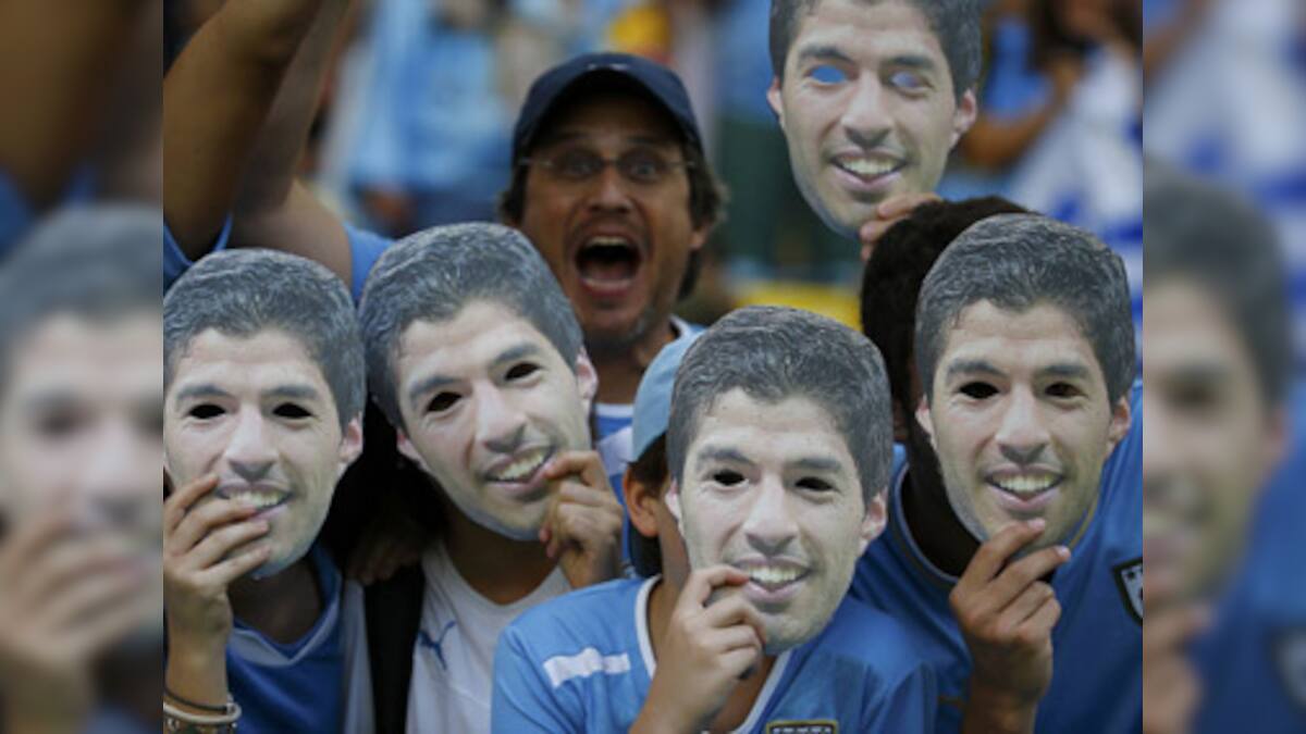 So what if he bites? Fans mob Suarez in Barcelona – Firstpost