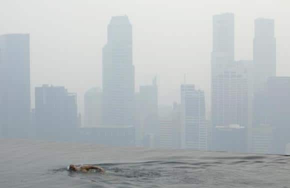 Singapore air pollution slips into unhealthy level – Firstpost
