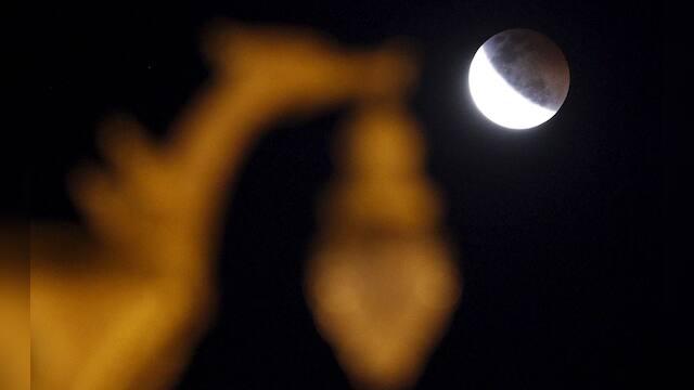 Photos: World watches in awe as lunar eclipse creates celestial beauty ...