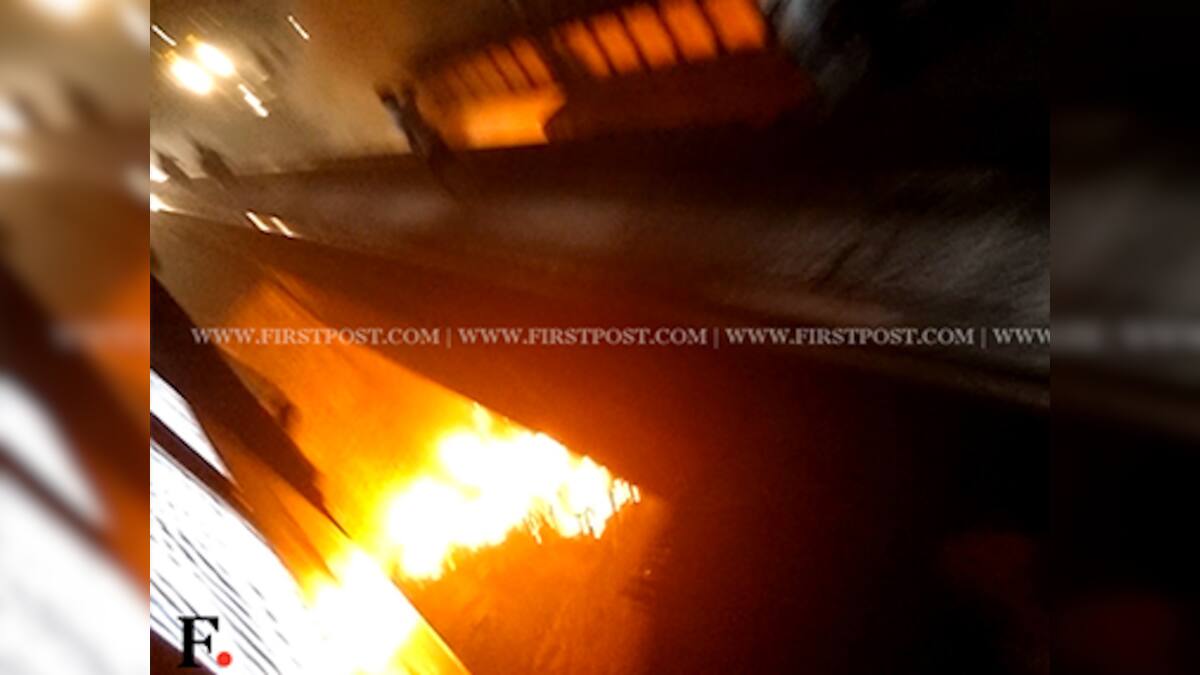 Watch: Huge fire engulfs culvert below railway tracks in Mumbai – Firstpost