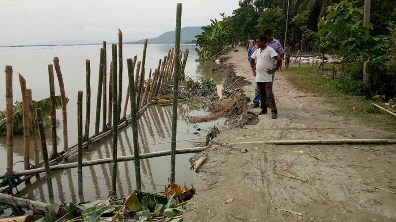 Marooned by floods, Assam's dead get watery grave as land disappear ...