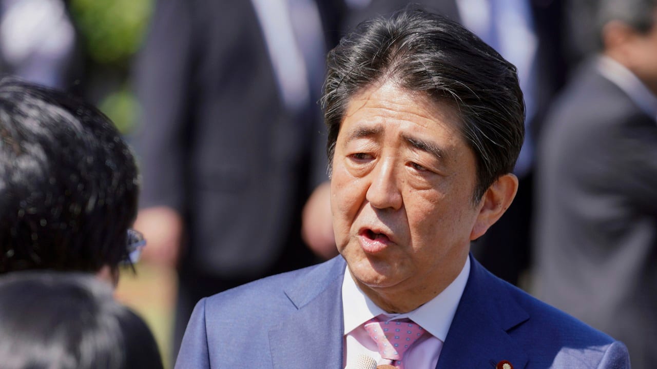 Prime Minister Shinzo Abe visits flood-hit zone in Japan's Okayama ...