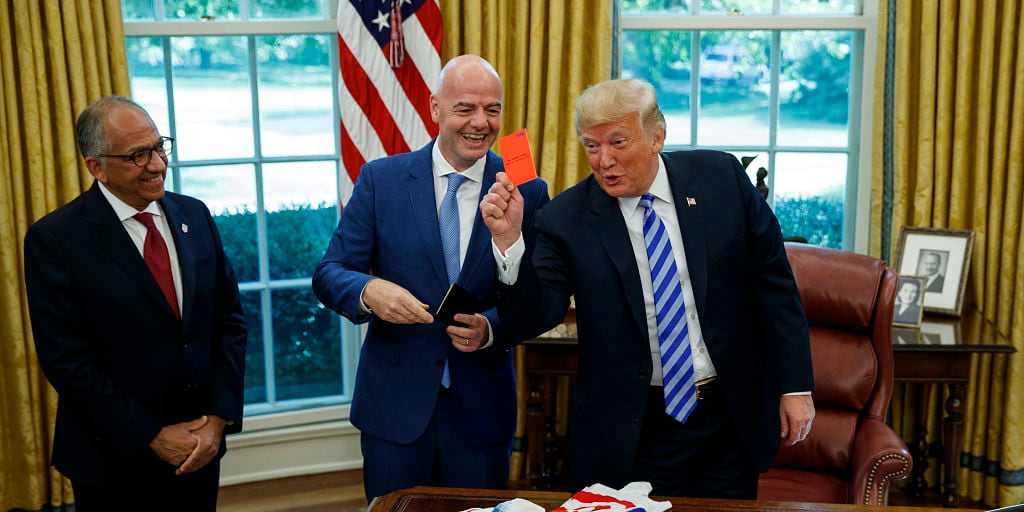 US President Donald Trump shows press red card after welcoming FIFA ...