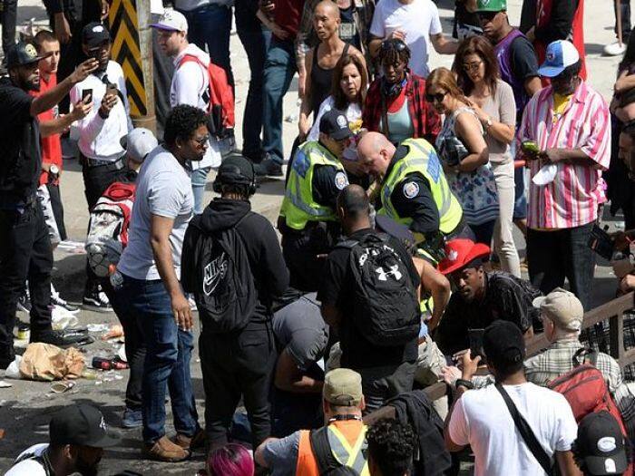 Four injured in gunfire at celebratory parade in Toronto; police arrest ...