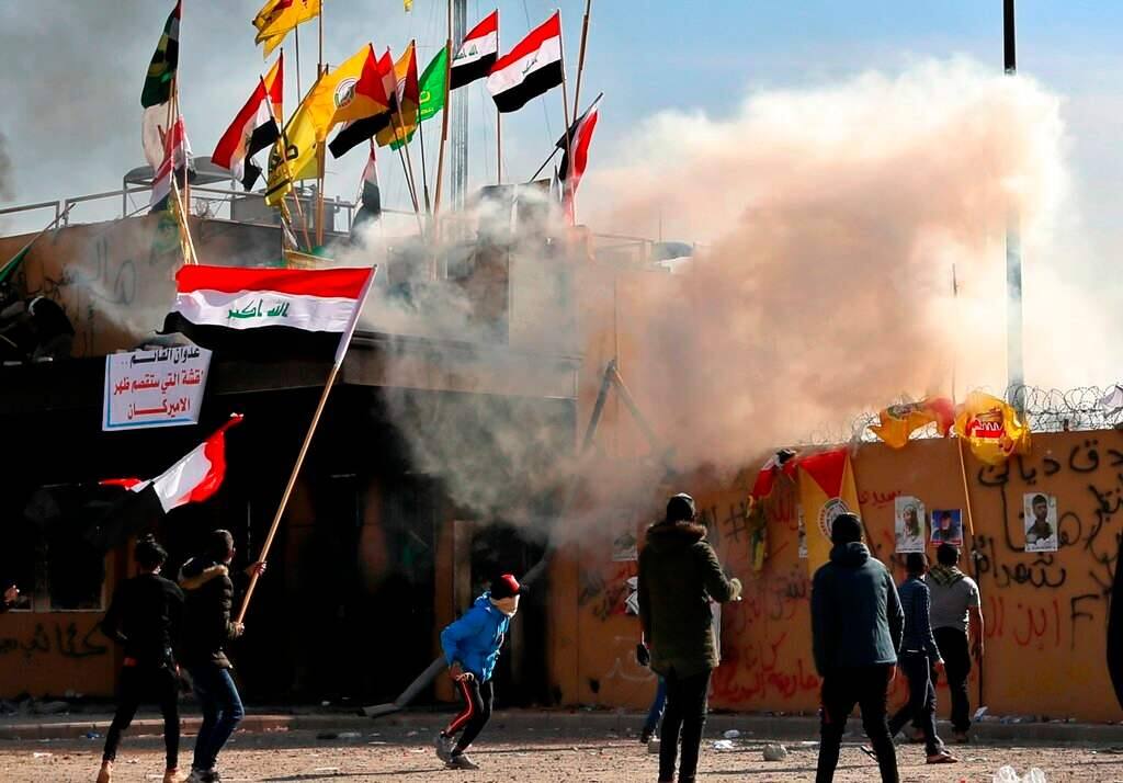 Day after attack on American embassy in Baghdad, US troops fire tear ...