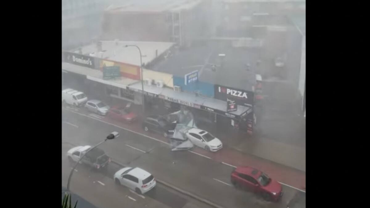 Australia: Metal roof crashes between cars during storm, watch viral ...