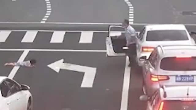Watch: Child falls out of car's window on busy road in China, motorists ...