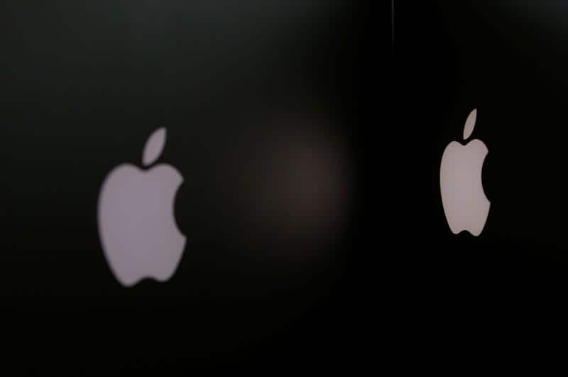 Apple shares slide after iPhone maker issues rare revenue warning ...